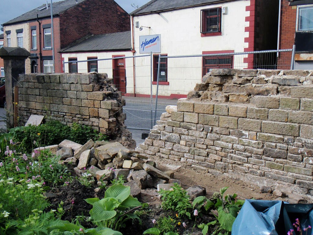 Rebuilding Stone Wall - UK Restoration Services