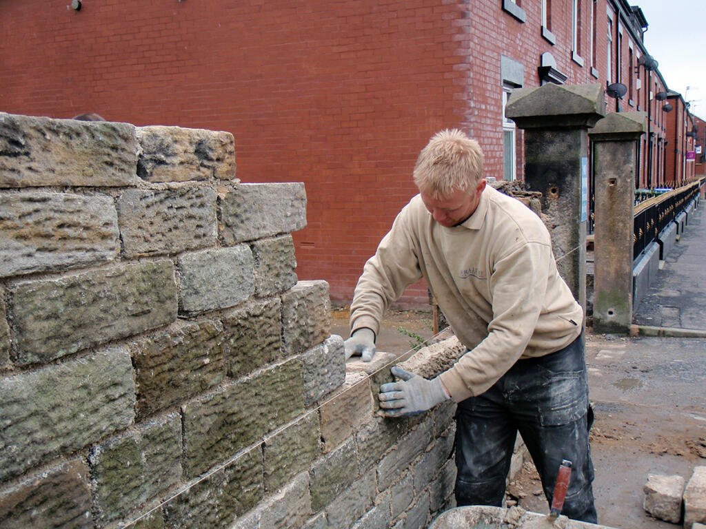 Rebuilding Stone Wall - UK Restoration Services