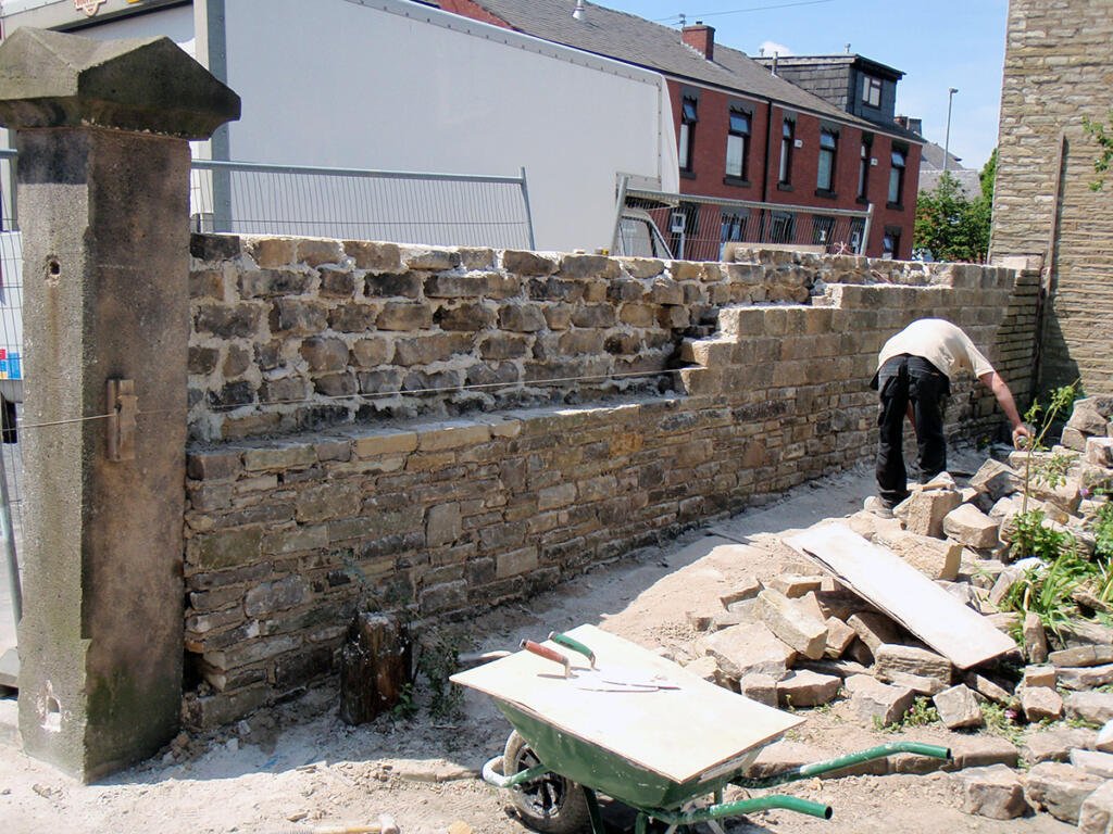 Rebuilding Stone Wall - UK Restoration Services